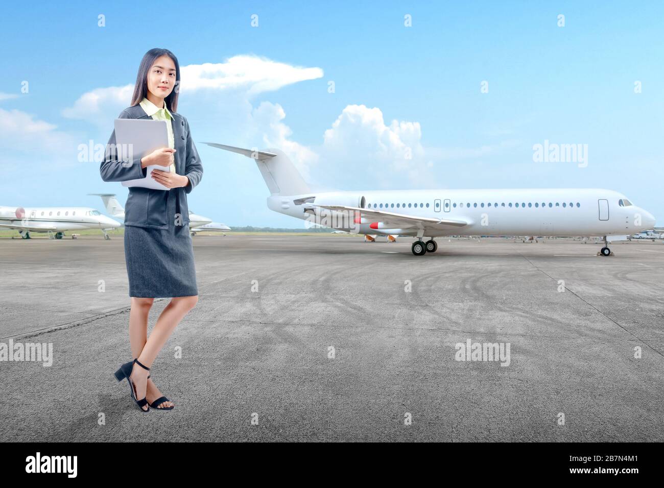 Woman carrying a laptop computer hi-res stock photography and images ...