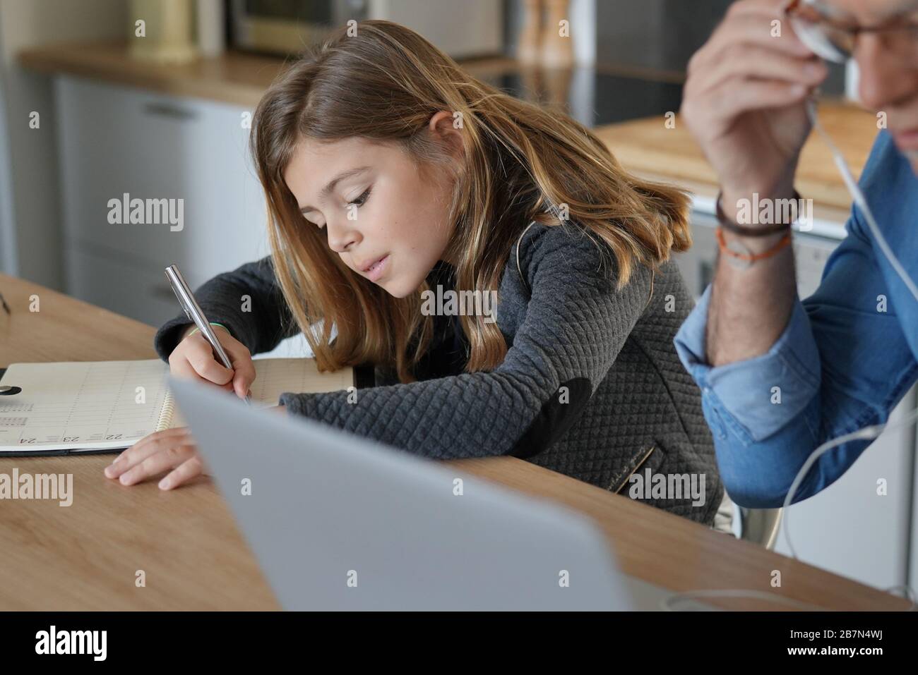 Father and child at home doing online school teaching class Stock Photo ...
