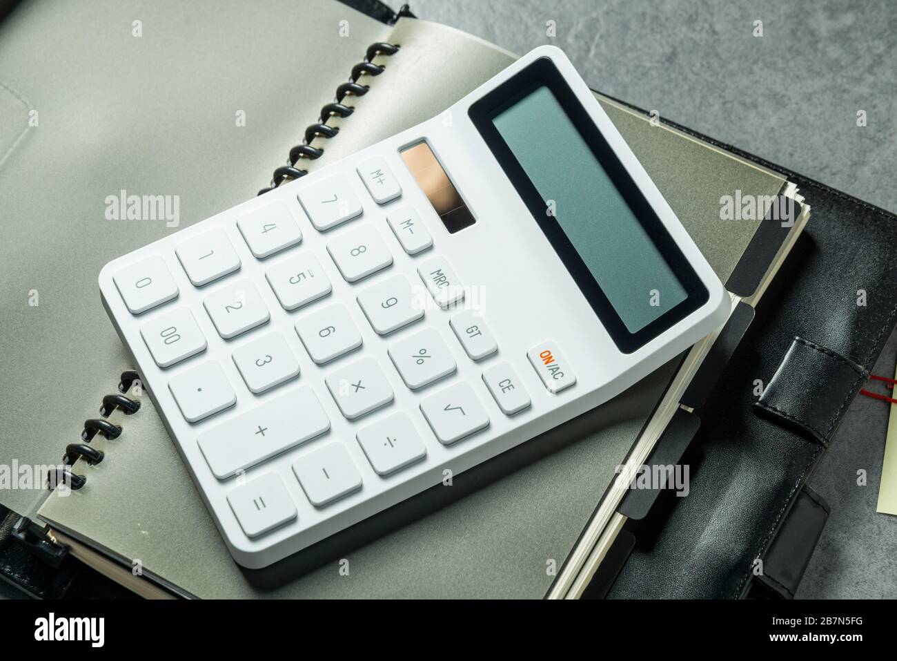 A calculator on the table.The Chinese meaning is: financial resources ...