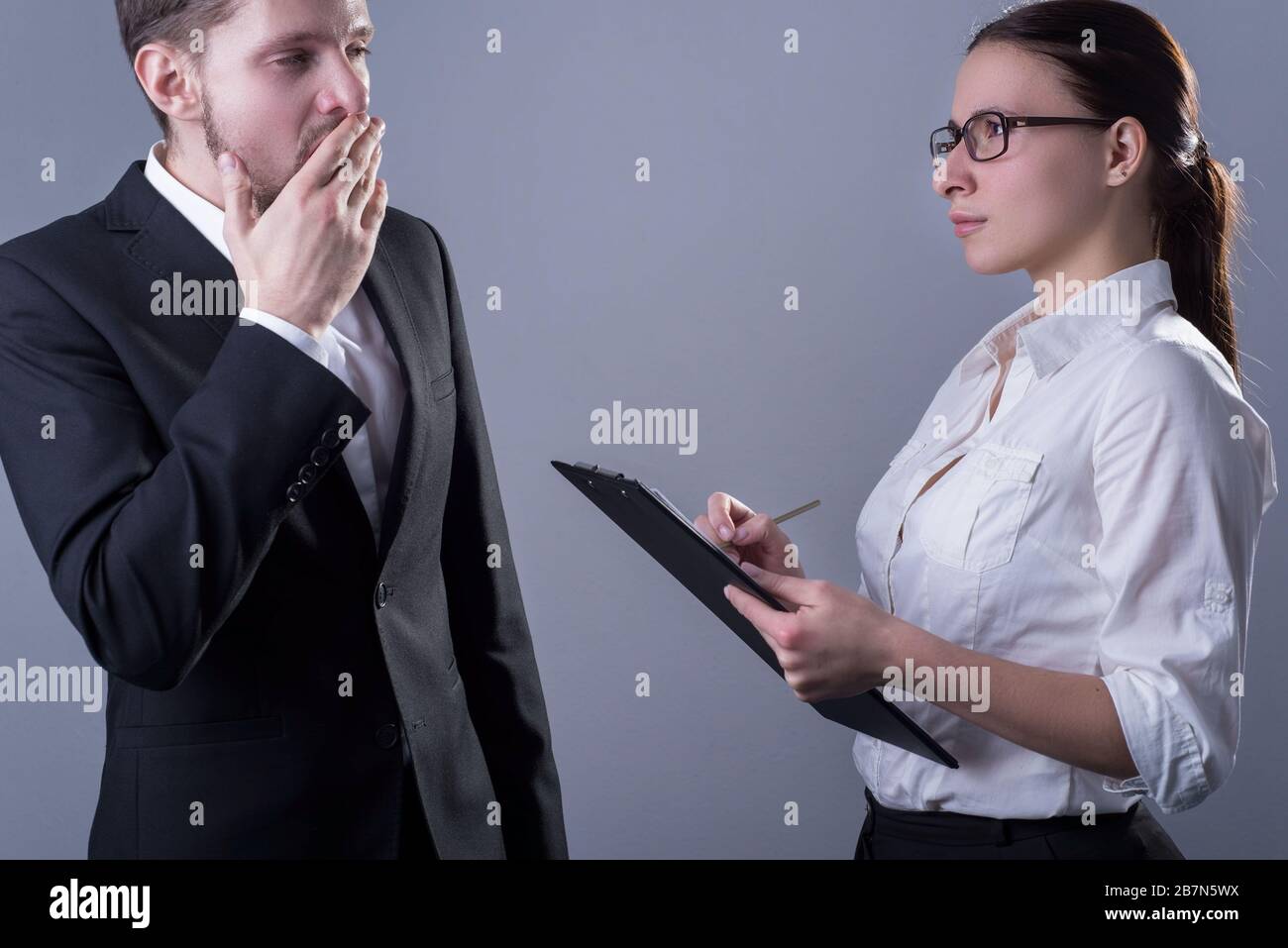 Portrait of young business people in business suits. The subordinate ...