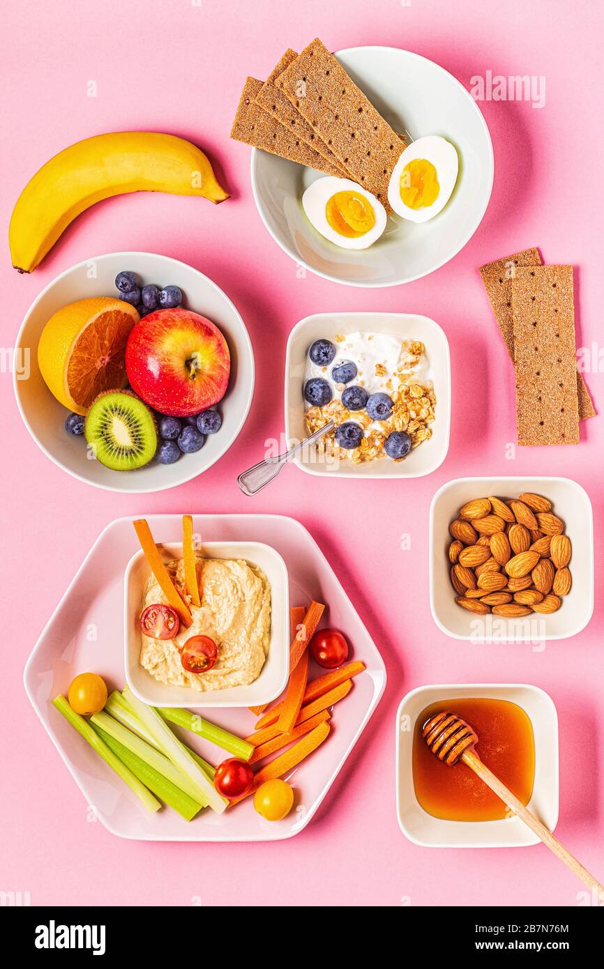 Healthy snack on a pastel background, top view Stock Photo - Alamy
