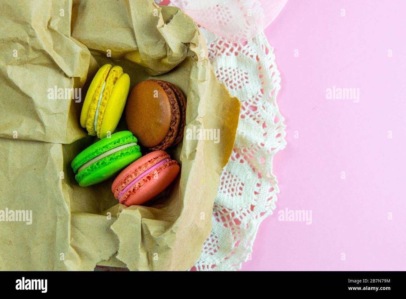 Yellow, pink, green and brown macaroons in the craft pack on pinc ...