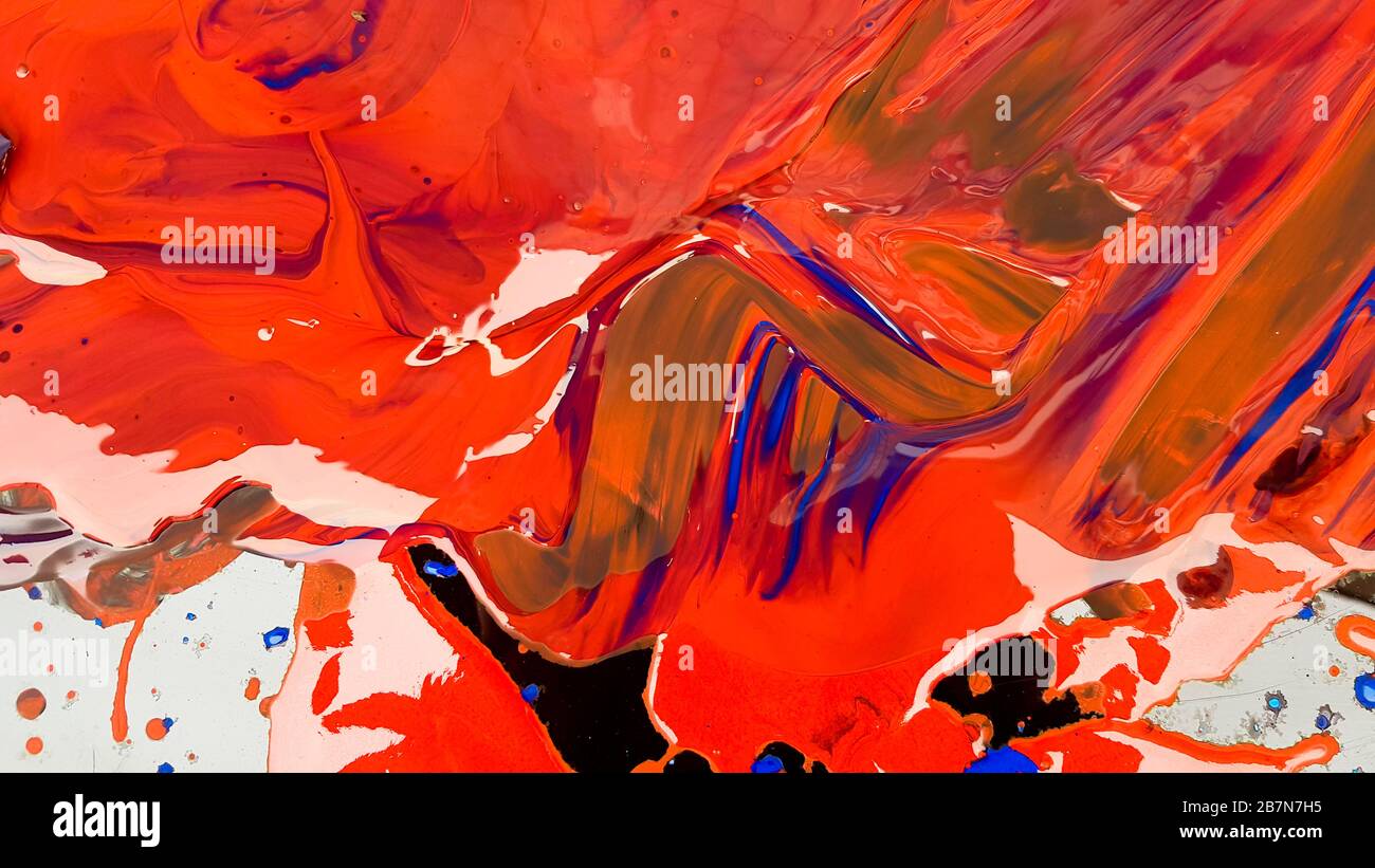 Abstract background of spilled red paint with buckets on a black ...