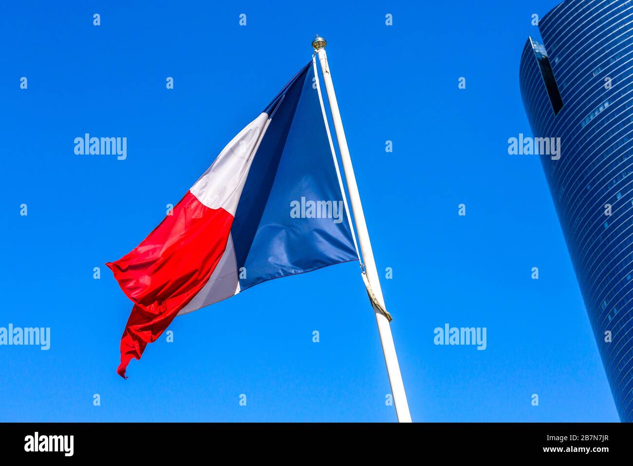 crumpled and half-masted French flag symbolically depicting economic ...