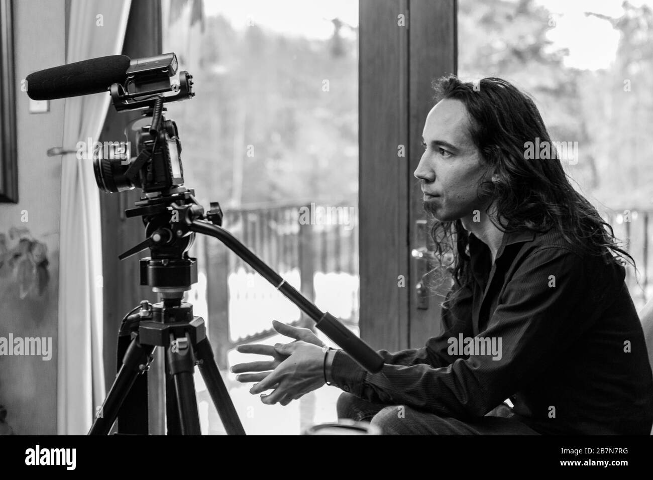 A side profile view in black and white of a professional documentary ...