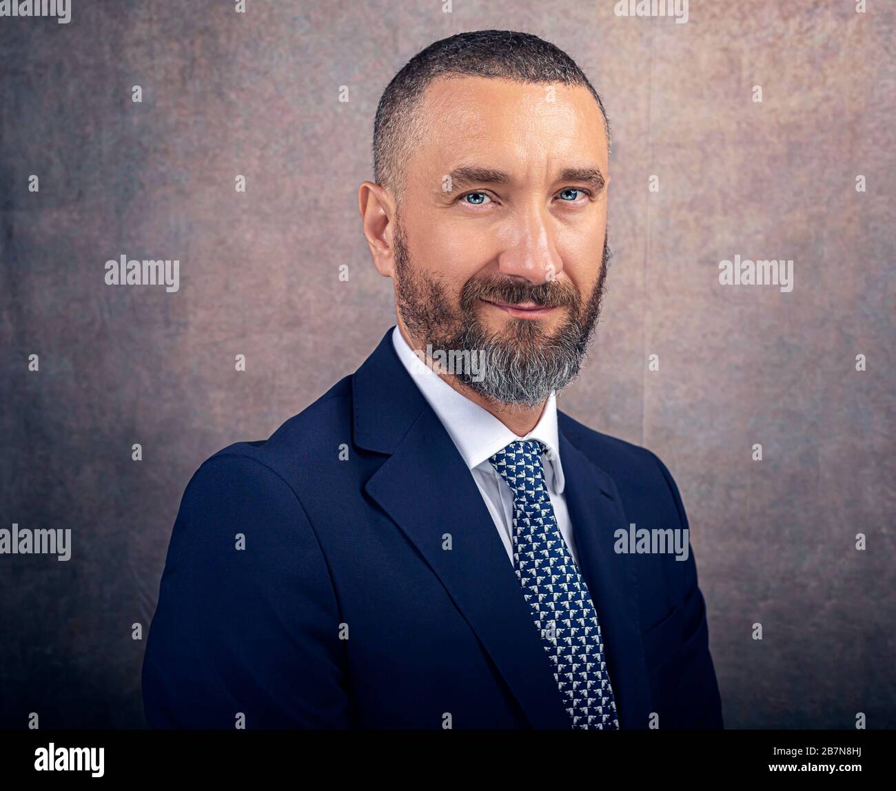 Happy grizzled man on 50s with beard looking into the camera Stock ...