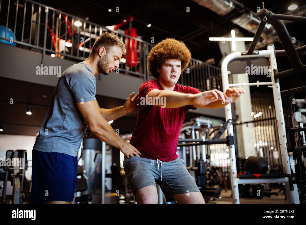 Strong overweight man training instructor hi-res stock photography and ...