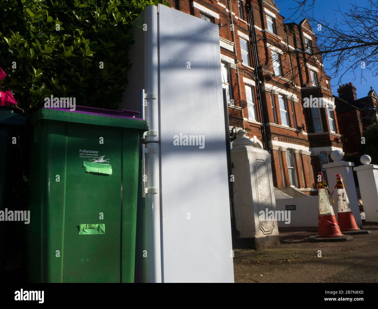 Fridge freezer fly tipped in a residential street Stock Photo - Alamy