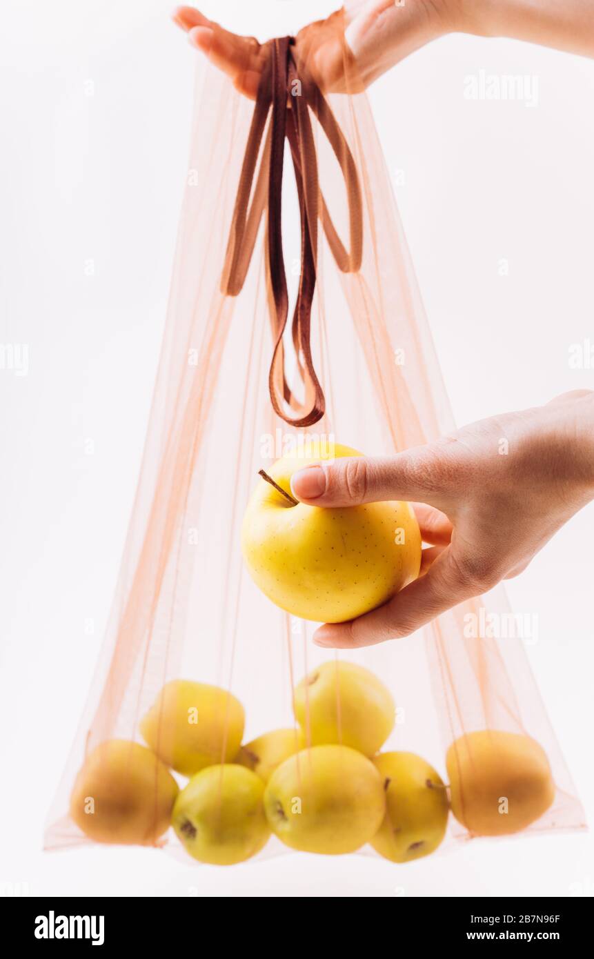 Eco packs. Eco bag with apples. Purchase without harm to nature in anti ...