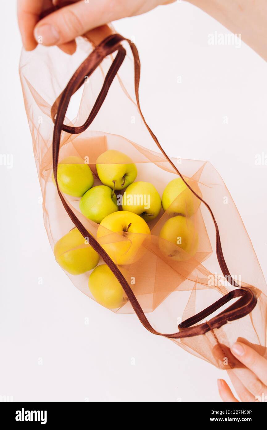 Eco packs. Eco bag with apples. Purchase without harm to nature in anti ...