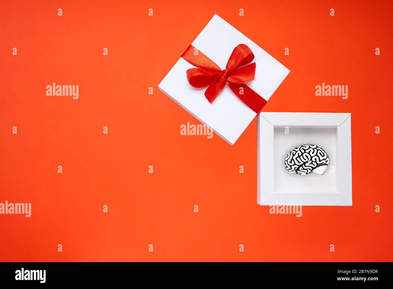 Creative present in form of a small copy of a human brain lying inside ...