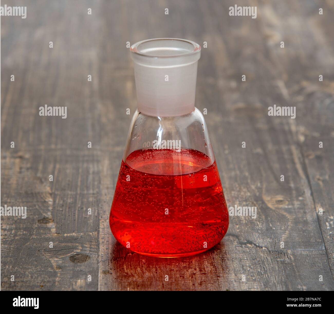 Medical Glass conical flask with red liquid Stock Photo - Alamy