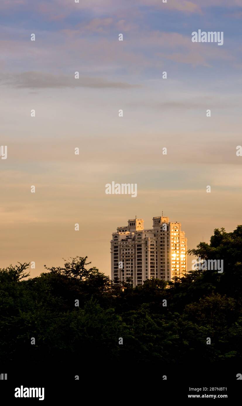 Light of the sun Glare at glass of high-rise building in the twilight ...