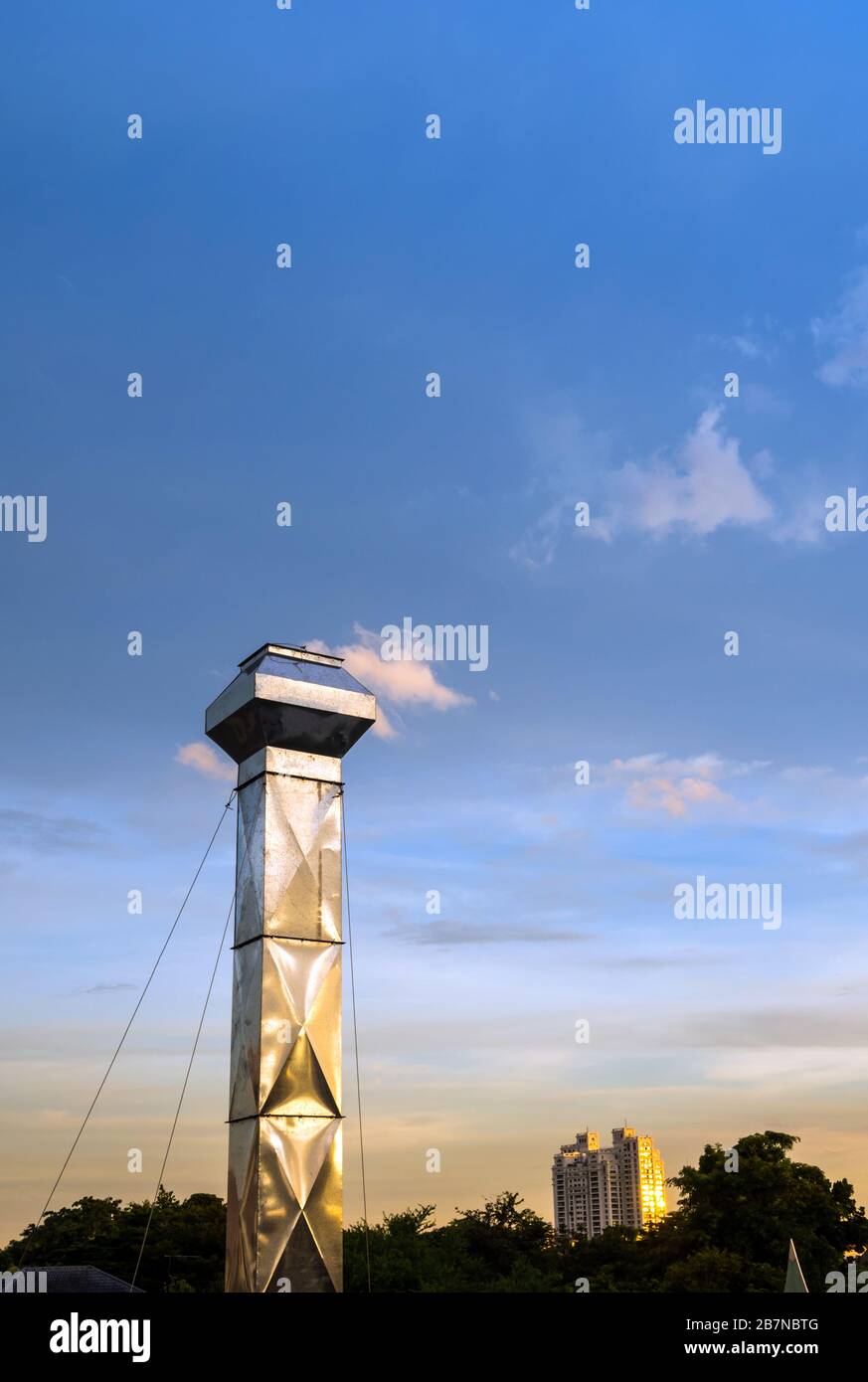 Shiny steel smokestack and cloud in twilight sparkle Stock Photo - Alamy