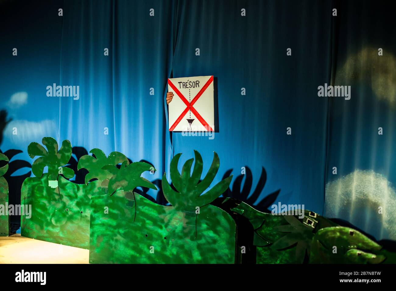 A french sign saying treasure with a big red cross, x marks the spot ...