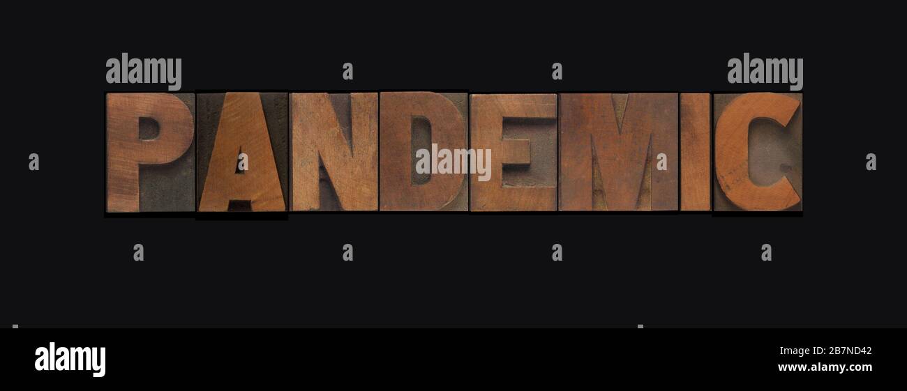 The word pandemic in letterpress wood letters on black background Stock ...