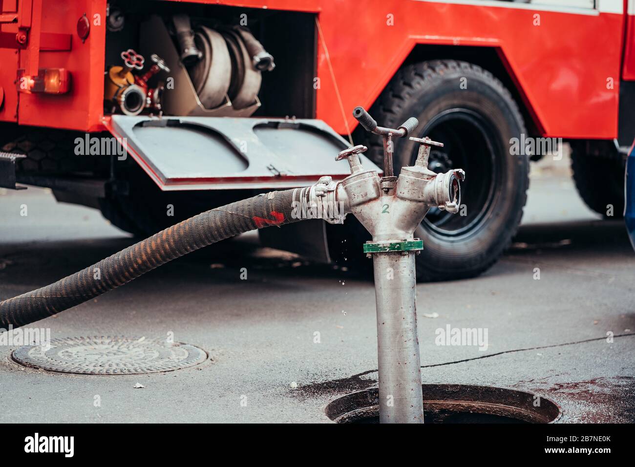 Fire Hydrant In Use During a Structure Fire Stock Photo - Alamy