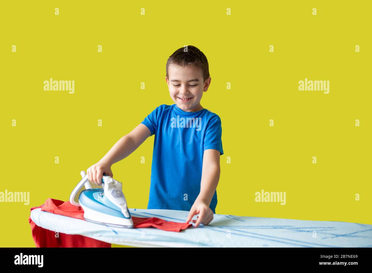 ironing little boy, kid working, child activity Stock Photo - Alamy