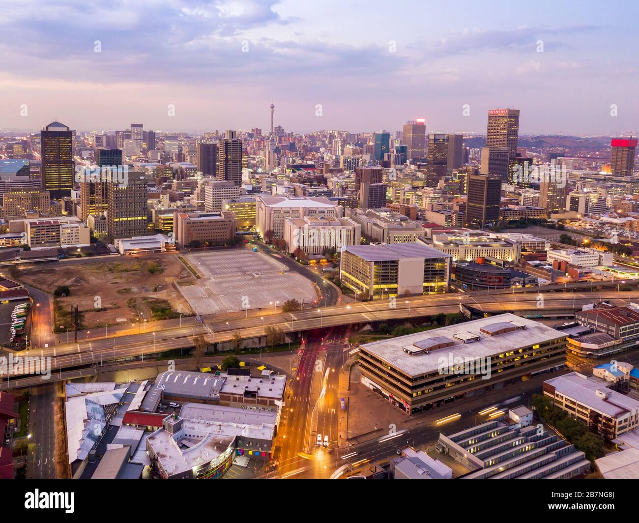 Aerial view of downtown of Johannesburg illuminated by car traffic ...