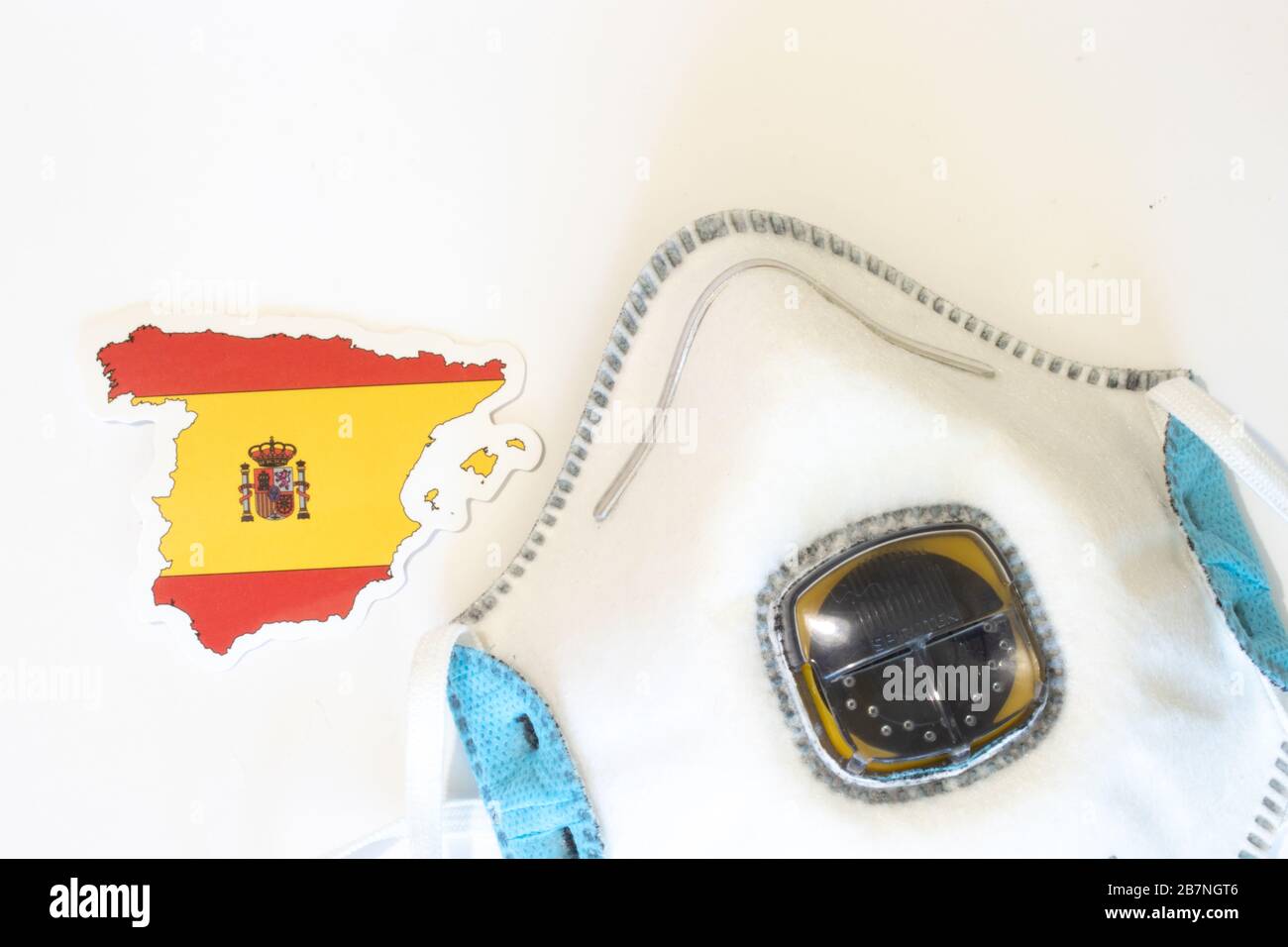 Respirator with Spain country flag top view. Flat lay with medical mask ...