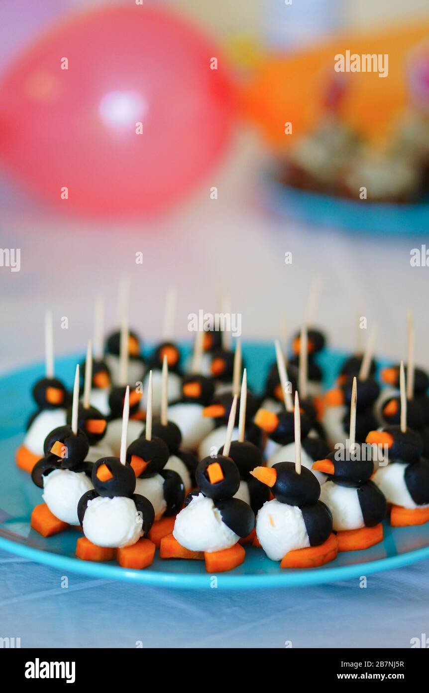 Lot of penguin snacks made with mozzarella cheese and carrots for a ...