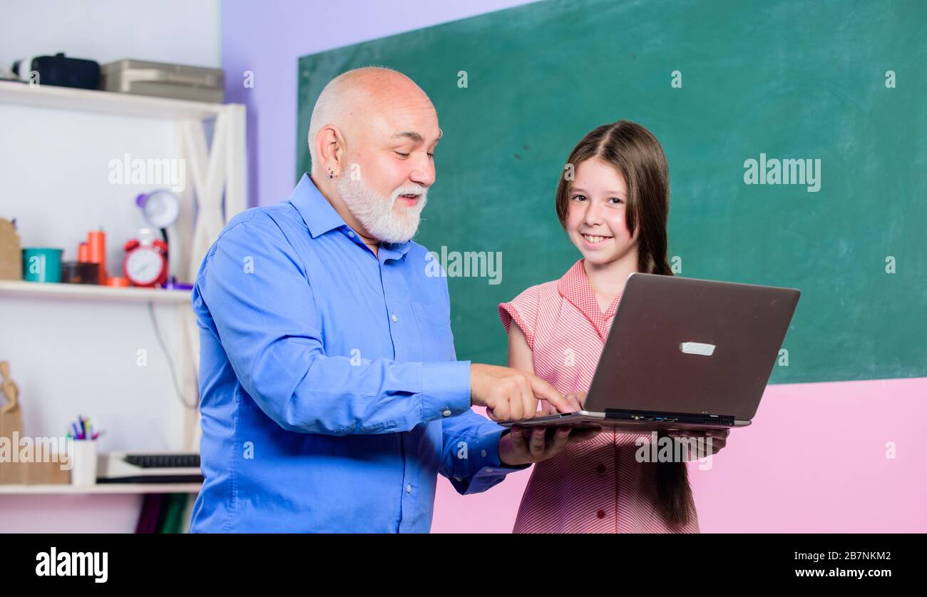 be a problem solver. small girl with man tutor study on laptop. school ...