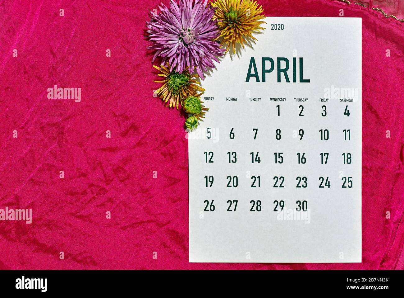 April monthly calendar on the red silk textile background Stock Photo ...