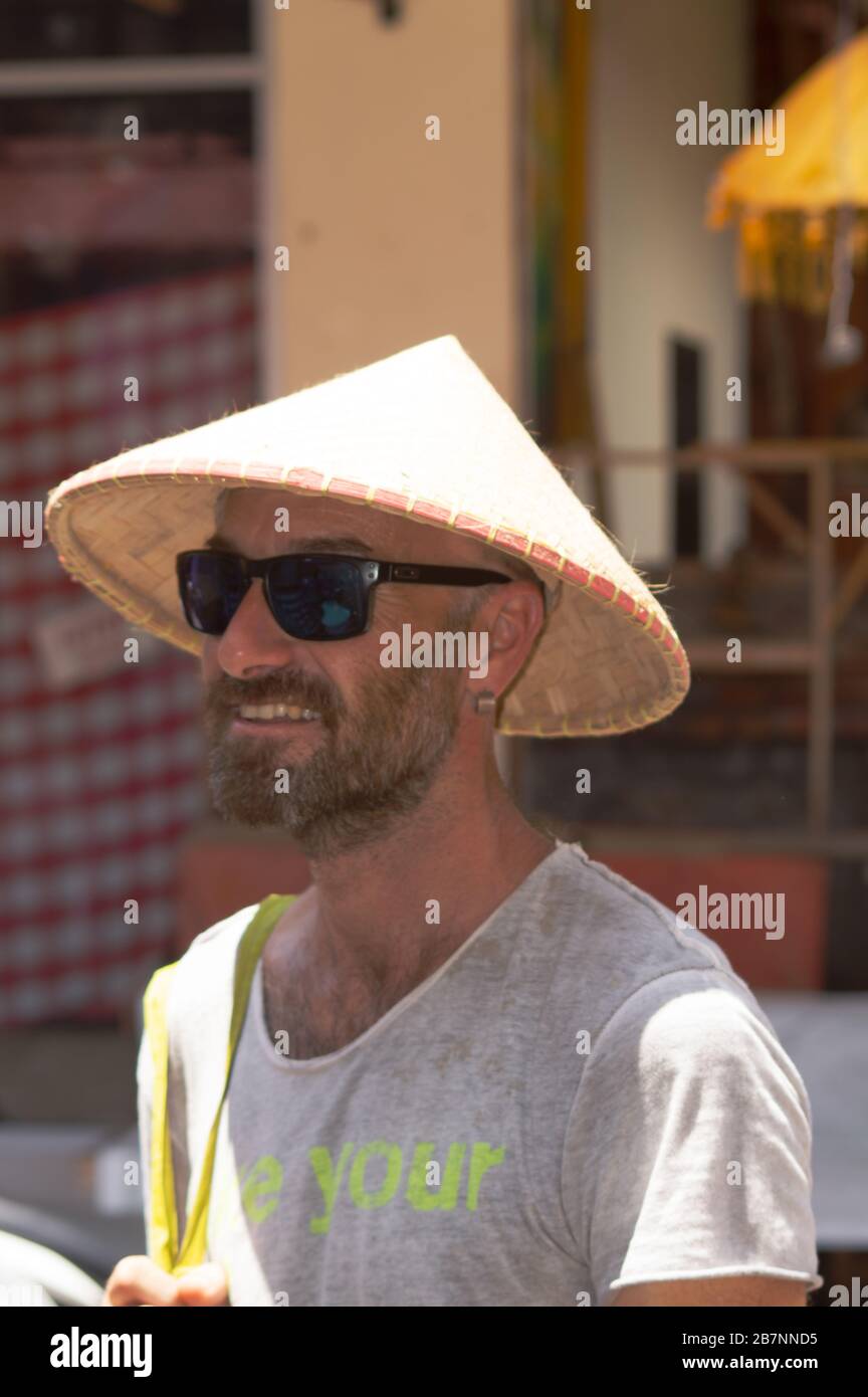 Caucasian Tourist in Asia with the vietnamese cone asian hat Stock ...