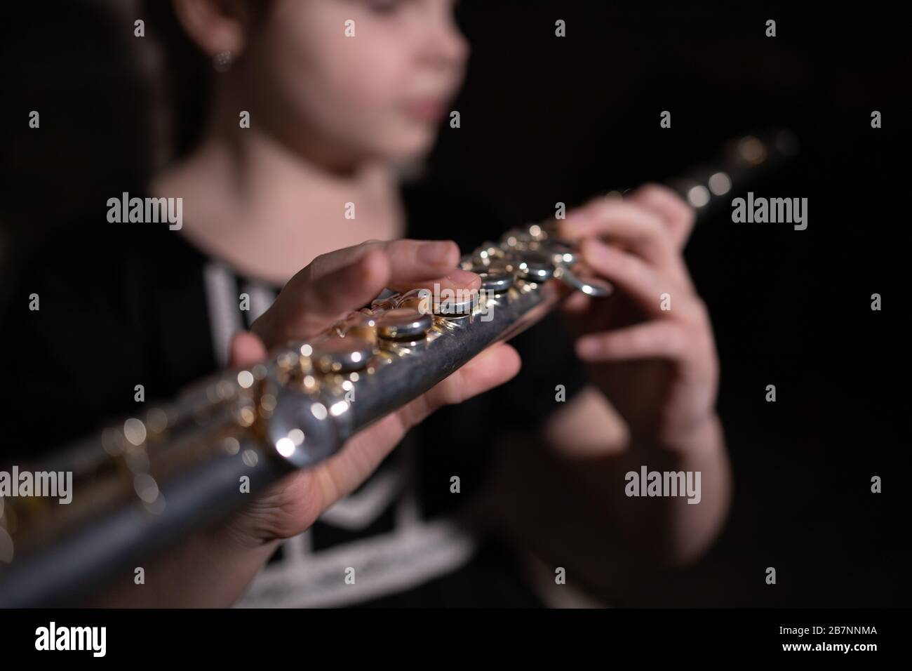 Girl playing the flute hi-res stock photography and images - Alamy