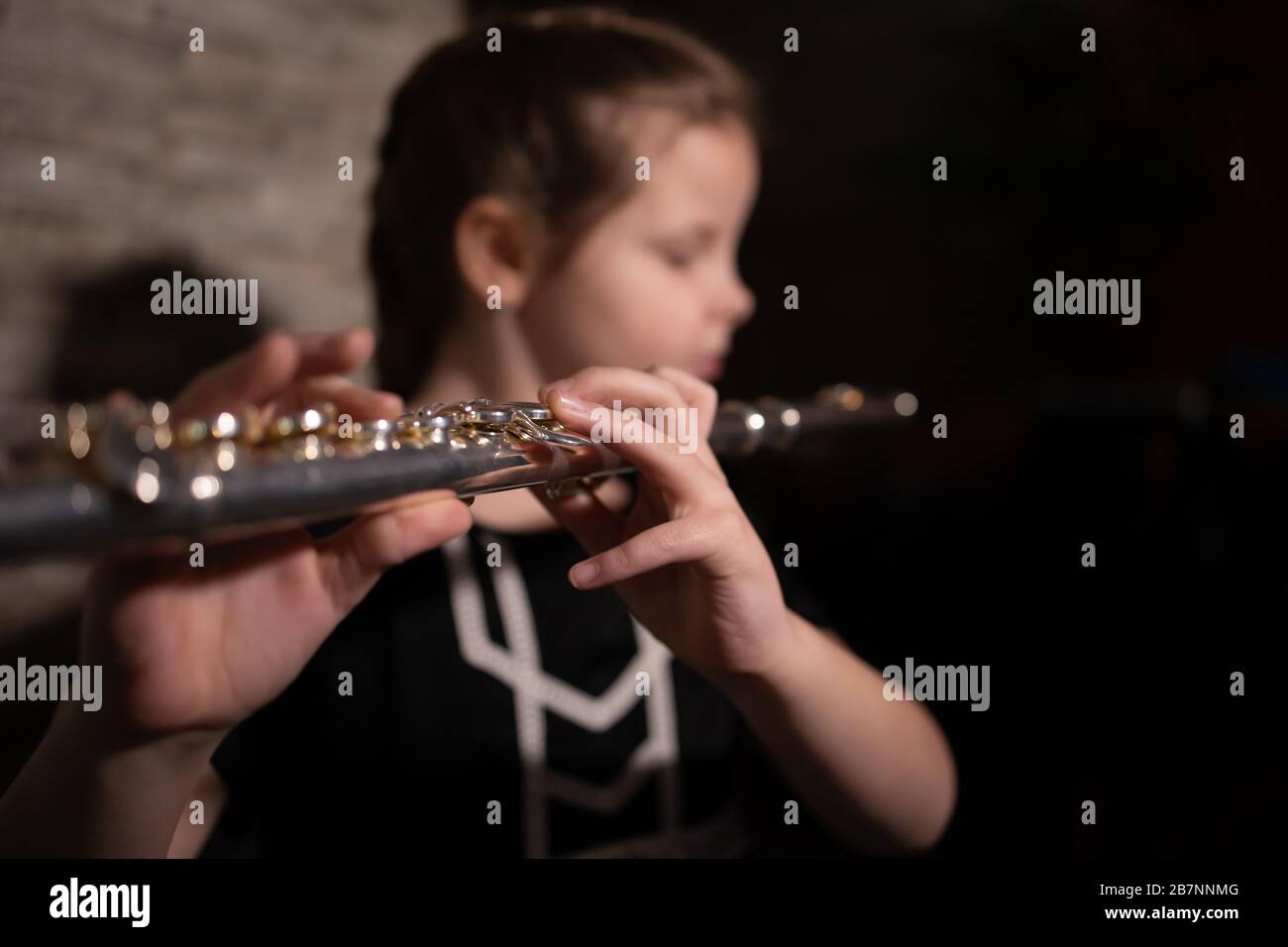 Girl playing the flute hi-res stock photography and images - Alamy