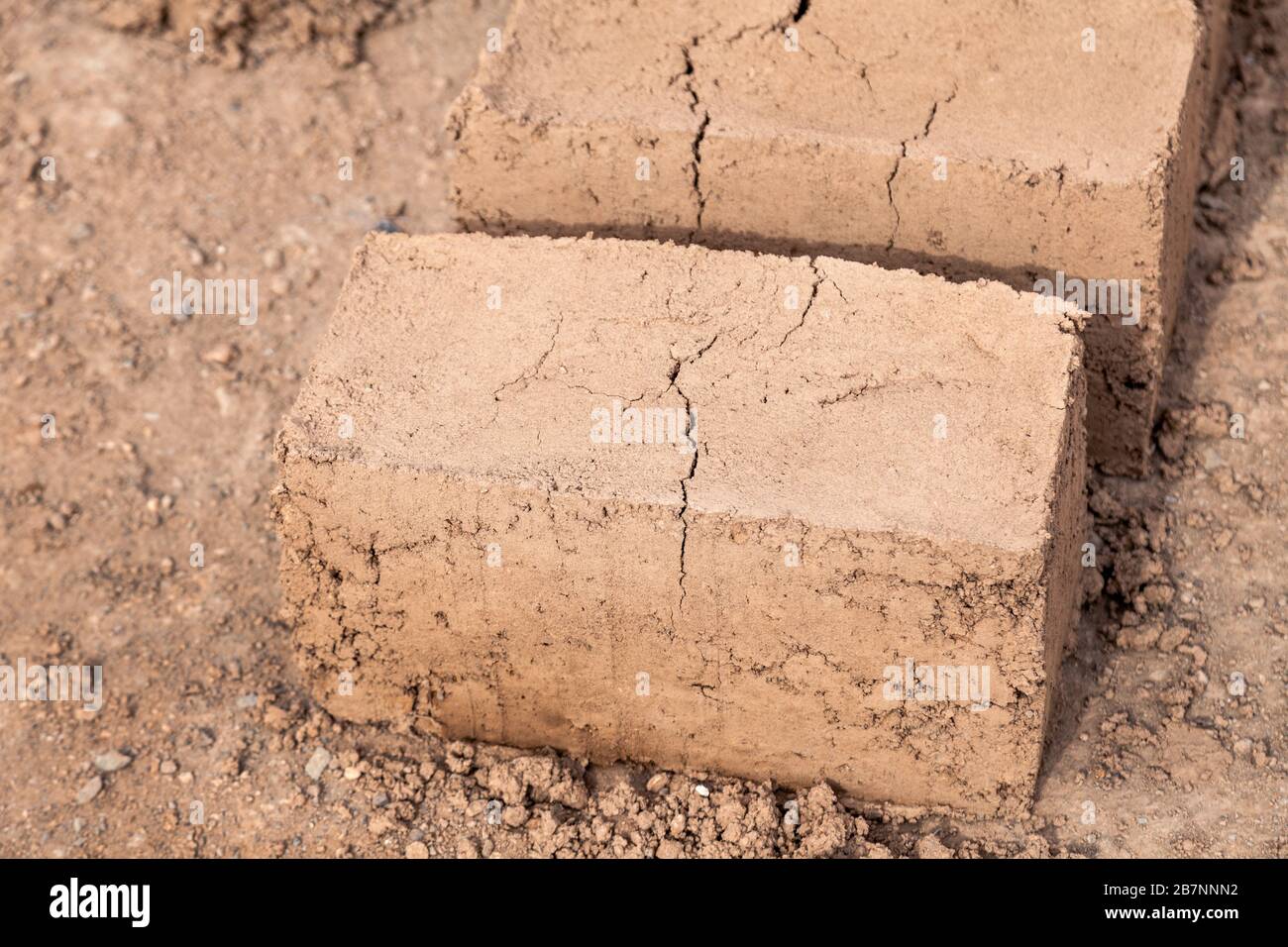 Traditional local asian craft homemade production of raw clay brick ...