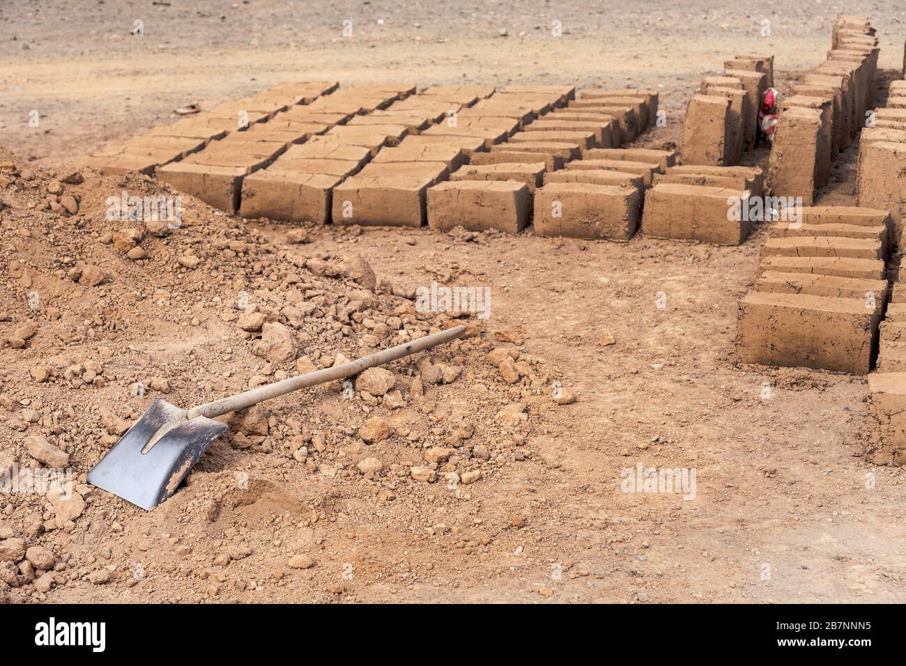Traditional local asian craft homemade production of raw clay brick ...
