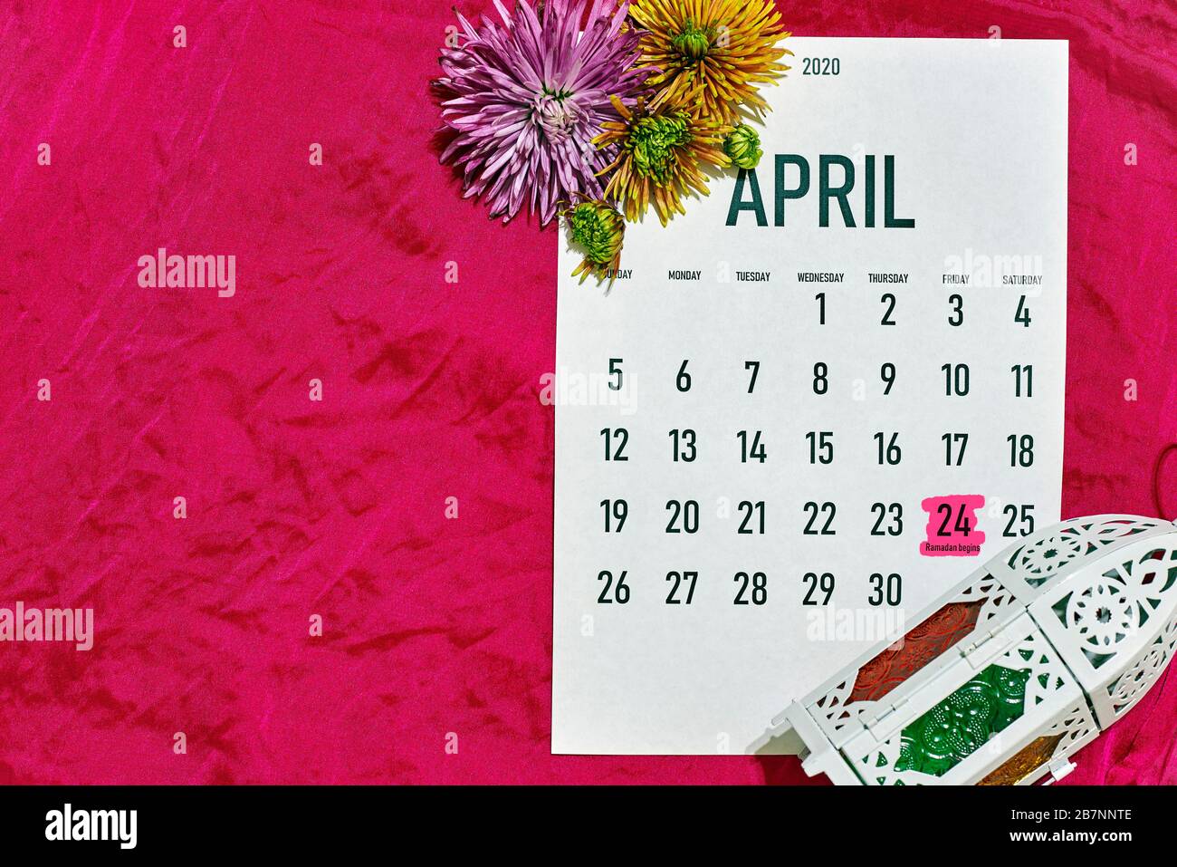 April monthly calendar on the red silk textile background. Islamic ...