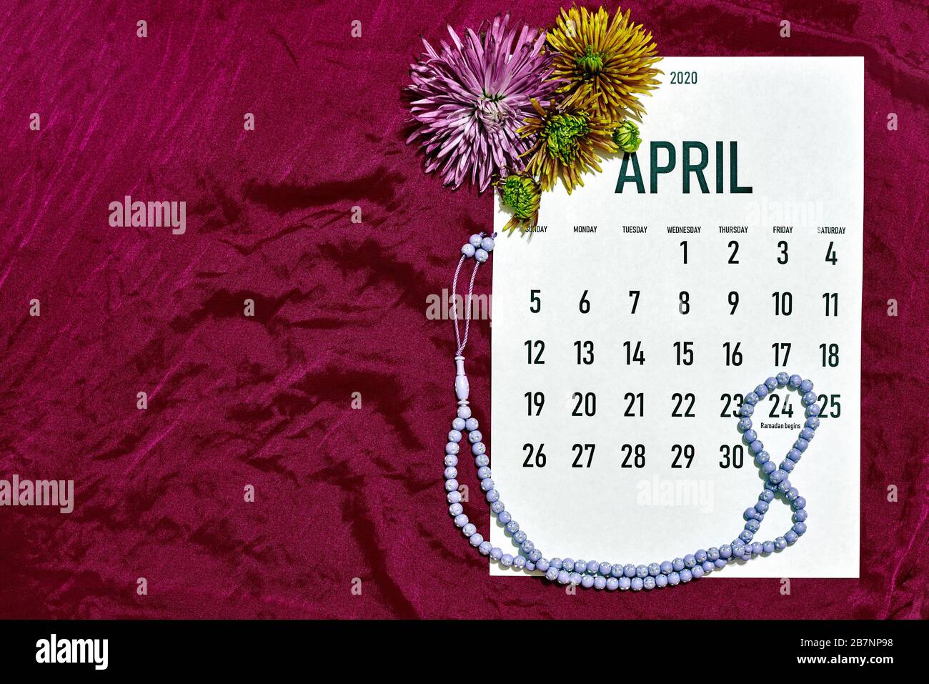April monthly calendar on the red silk textile background. Islamic ...