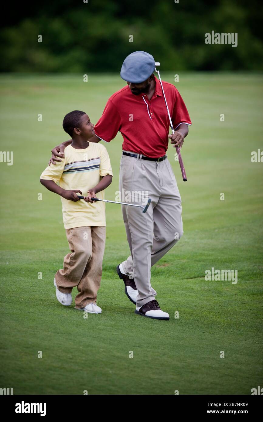 Boy and father golf green field hi-res stock photography and images - Alamy