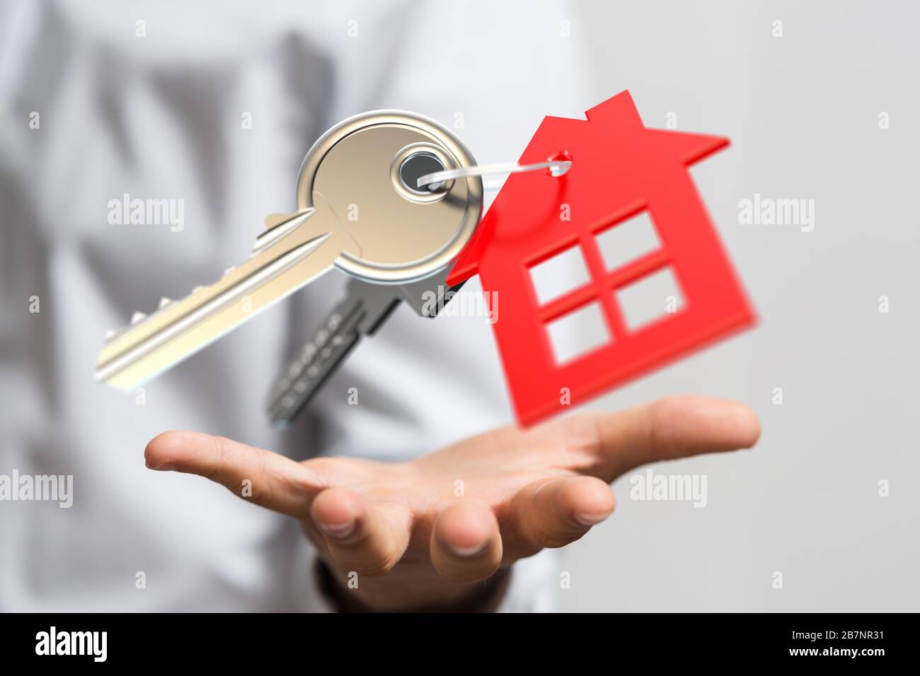 Woman man keys agent door hi-res stock photography and images - Alamy
