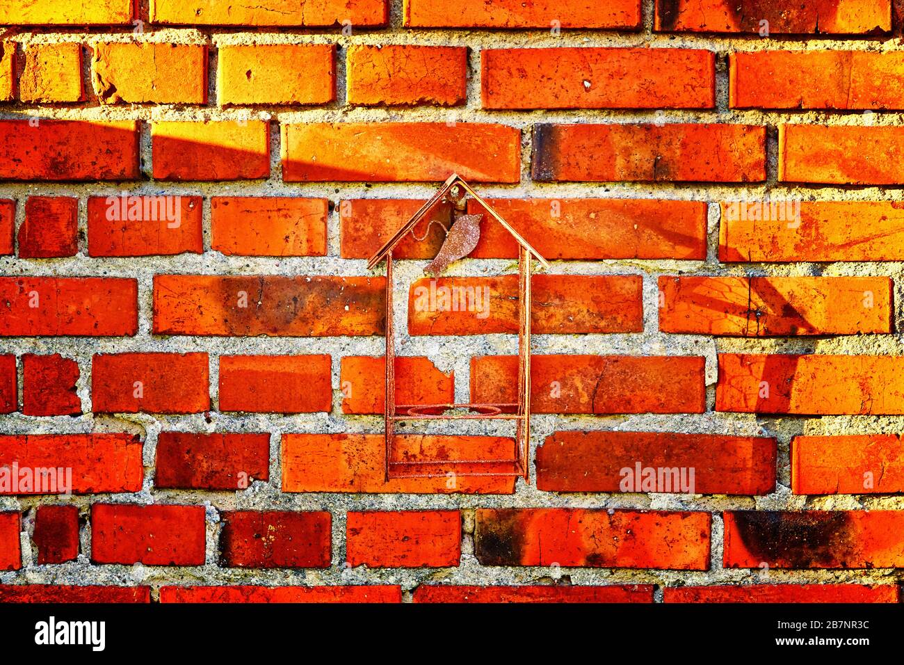 Old red brick wall with rusty metal decoration as background Stock ...