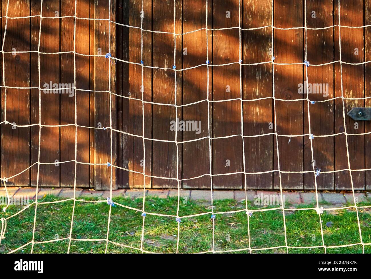 A net against a wood background Stock Photo - Alamy