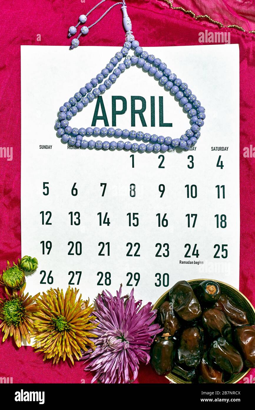 April monthly calendar on the red silk textile background. Islamic ...