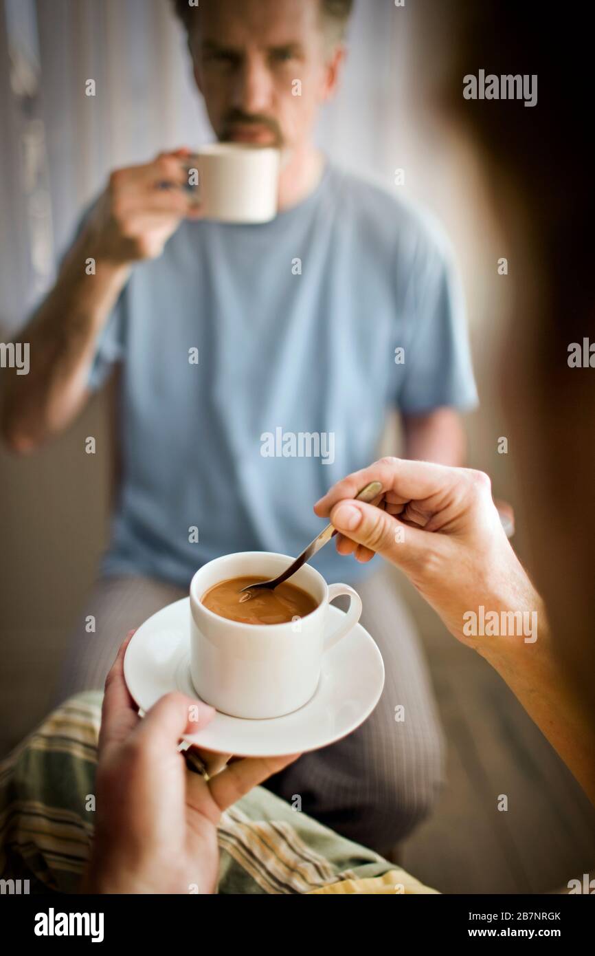 Coffee being stirred while being held Stock Photo - Alamy