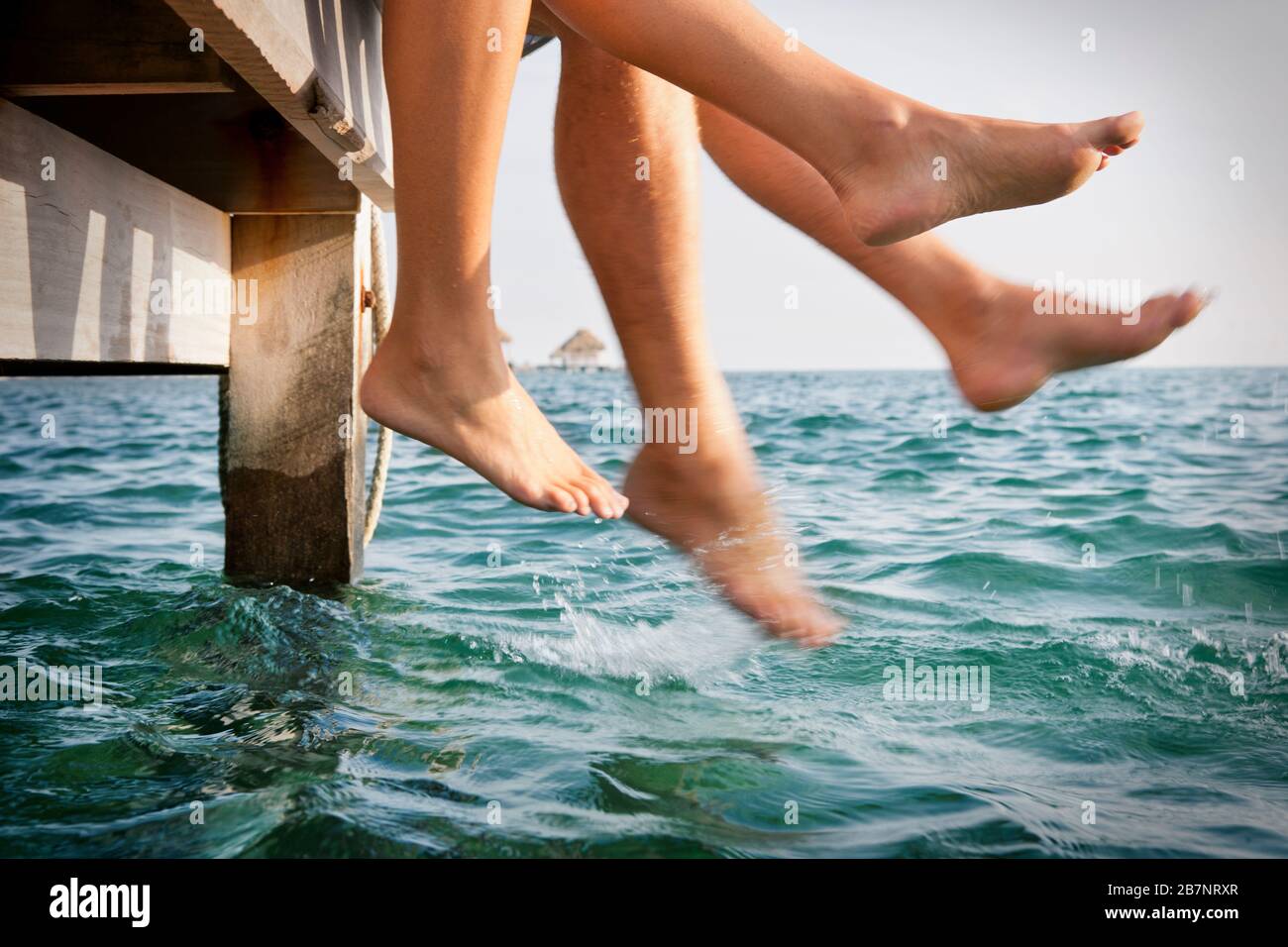 Feet hang off dock hi-res stock photography and images - Alamy