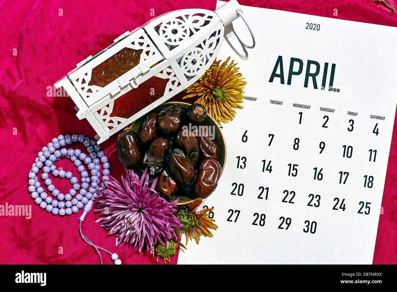 April monthly calendar on the red silk textile background. Islamic ...