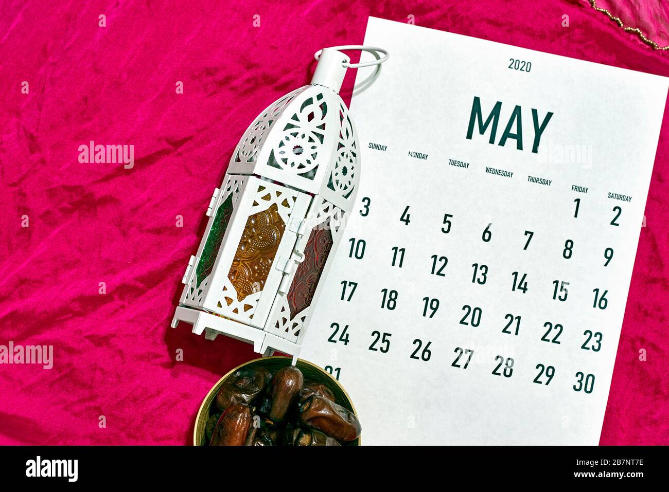 April monthly calendar on the red silk textile background. Islamic ...