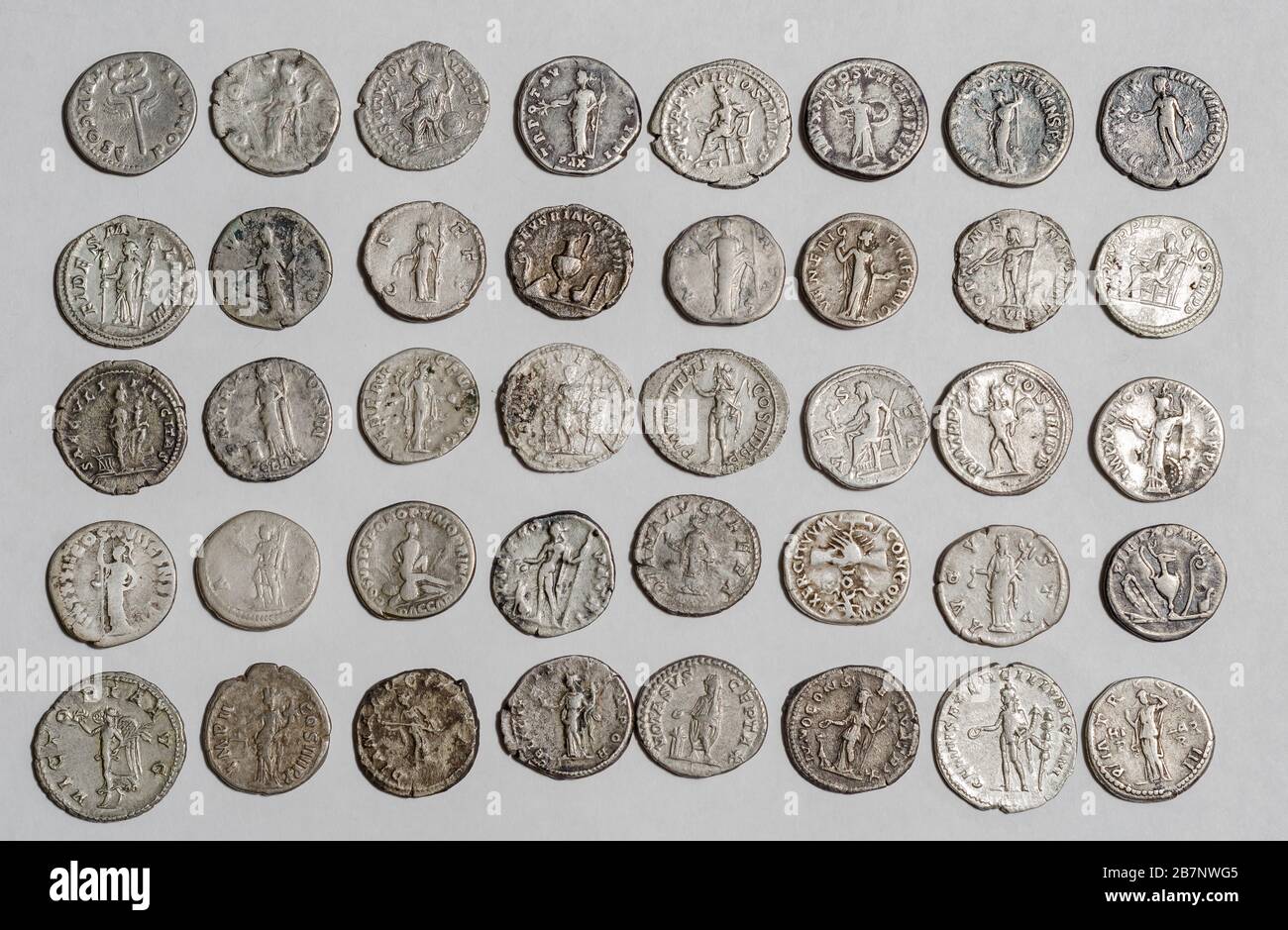 Antique Roman coins laid out in even rows Stock Photo - Alamy