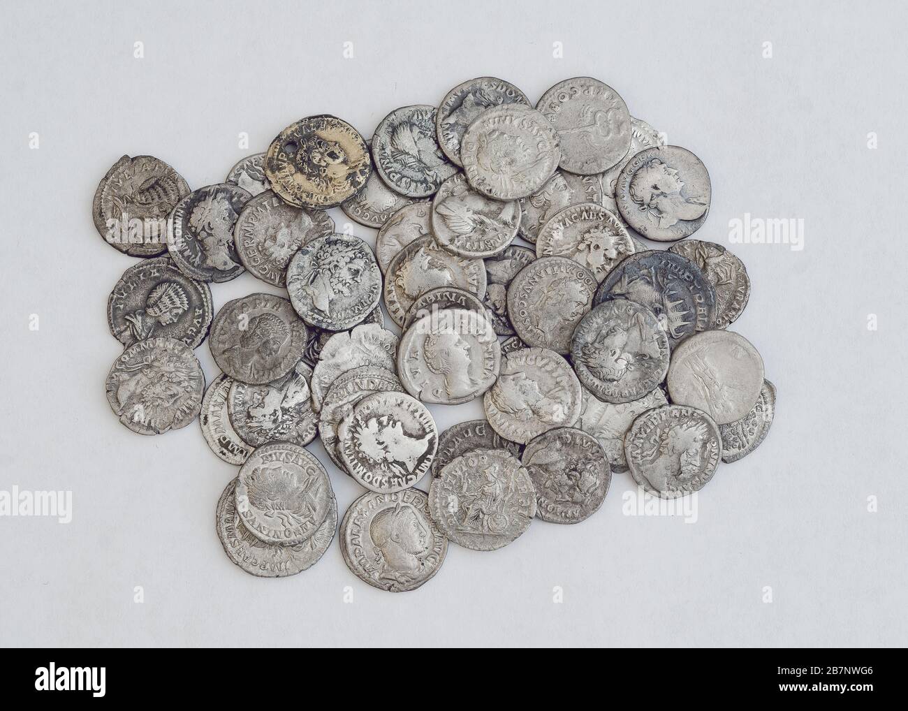 Antique Roman coins, small pile of cash on white background Stock Photo ...