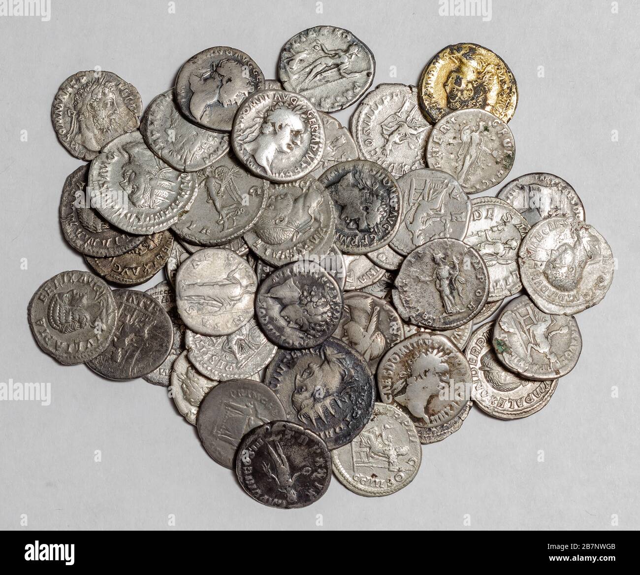 Antique Roman coins, small pile of cash on white background Stock Photo ...