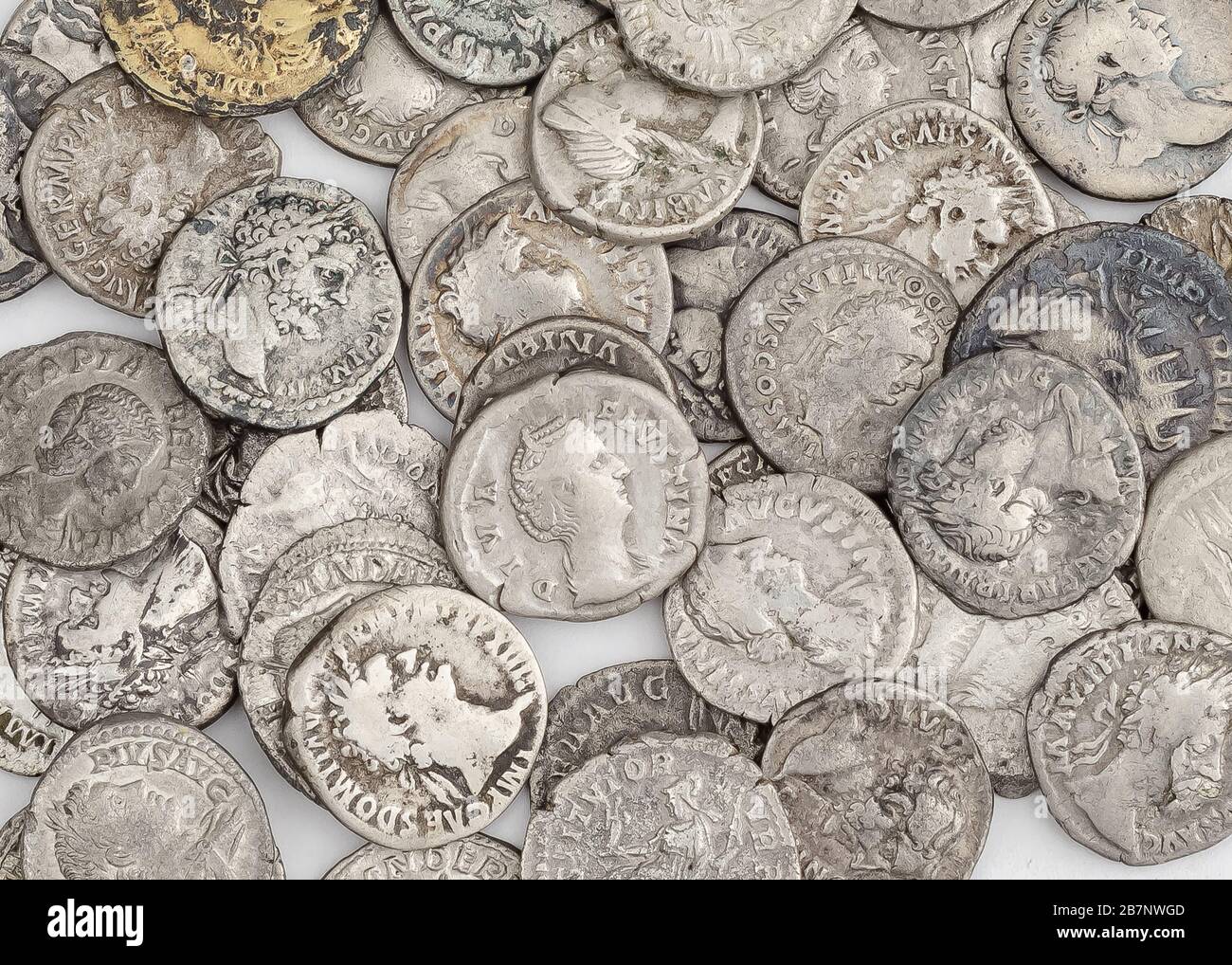 Antique Roman coins, small pile of cash on white background Stock Photo ...