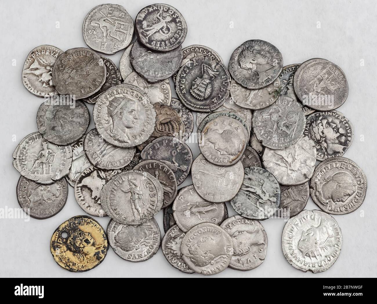 Antique Roman coins, small pile of cash on white background Stock Photo ...