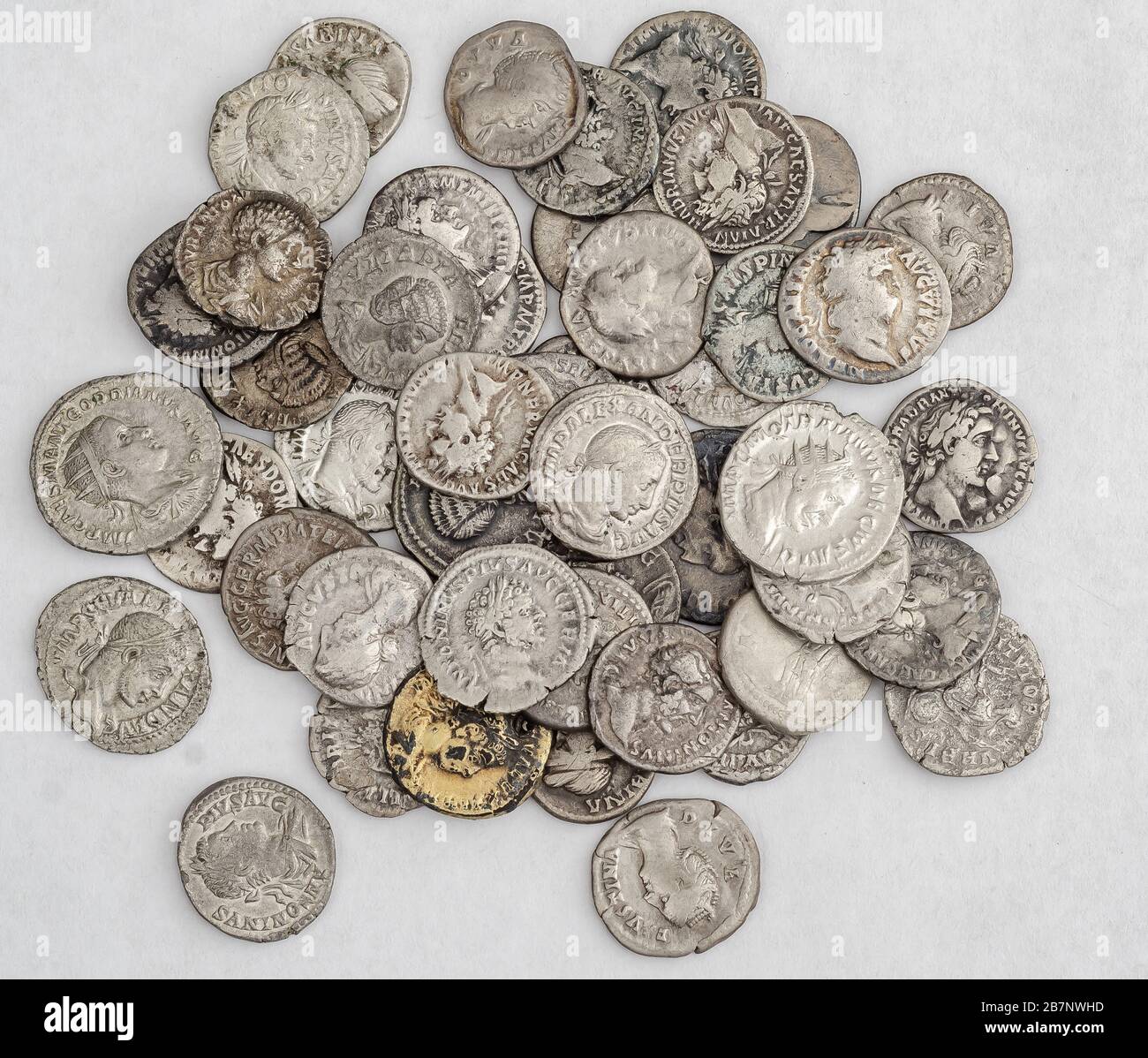 Antique Roman coins, small pile of cash on white background Stock Photo ...