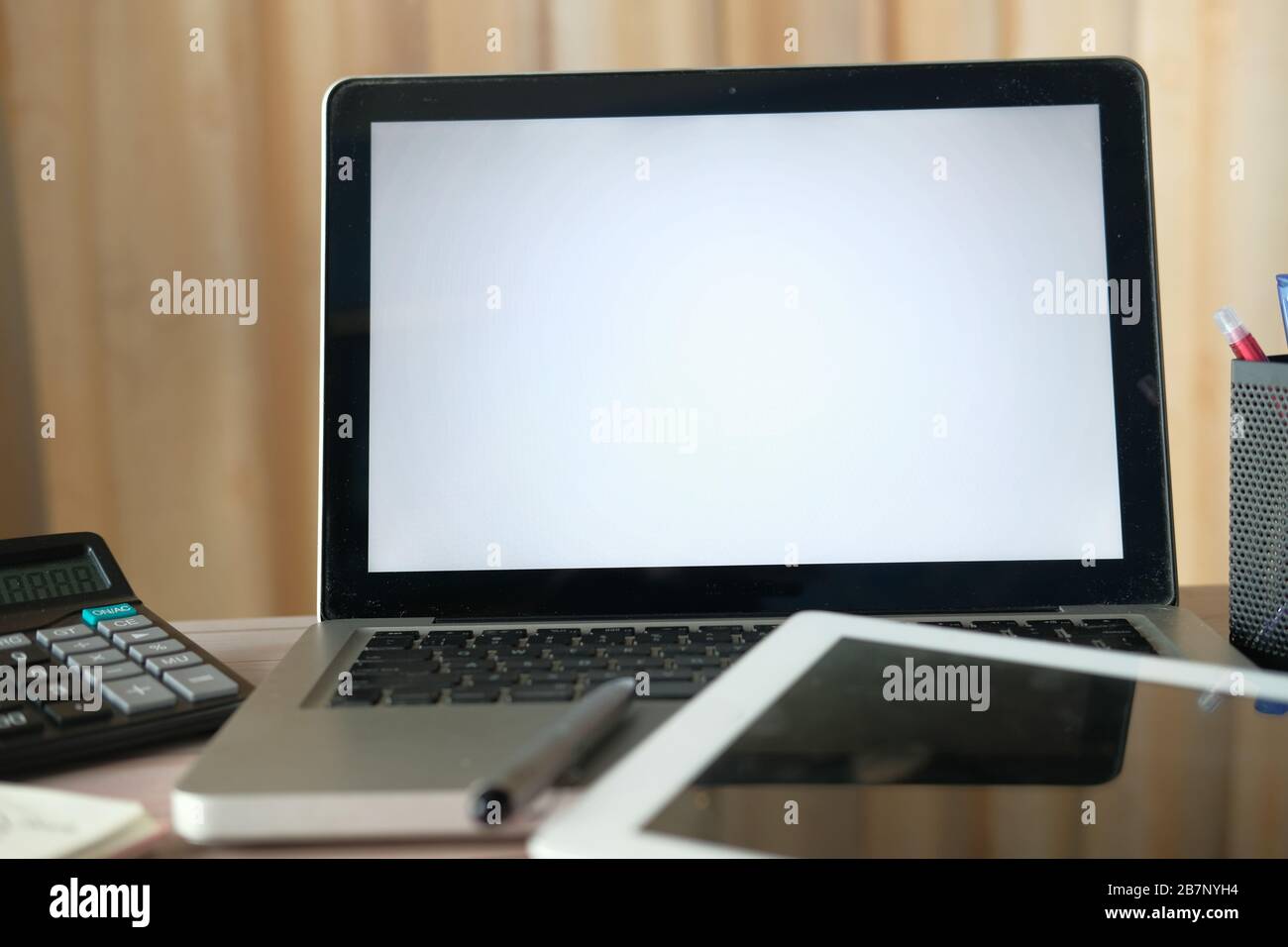 laptop with white screen on office table Stock Photo - Alamy